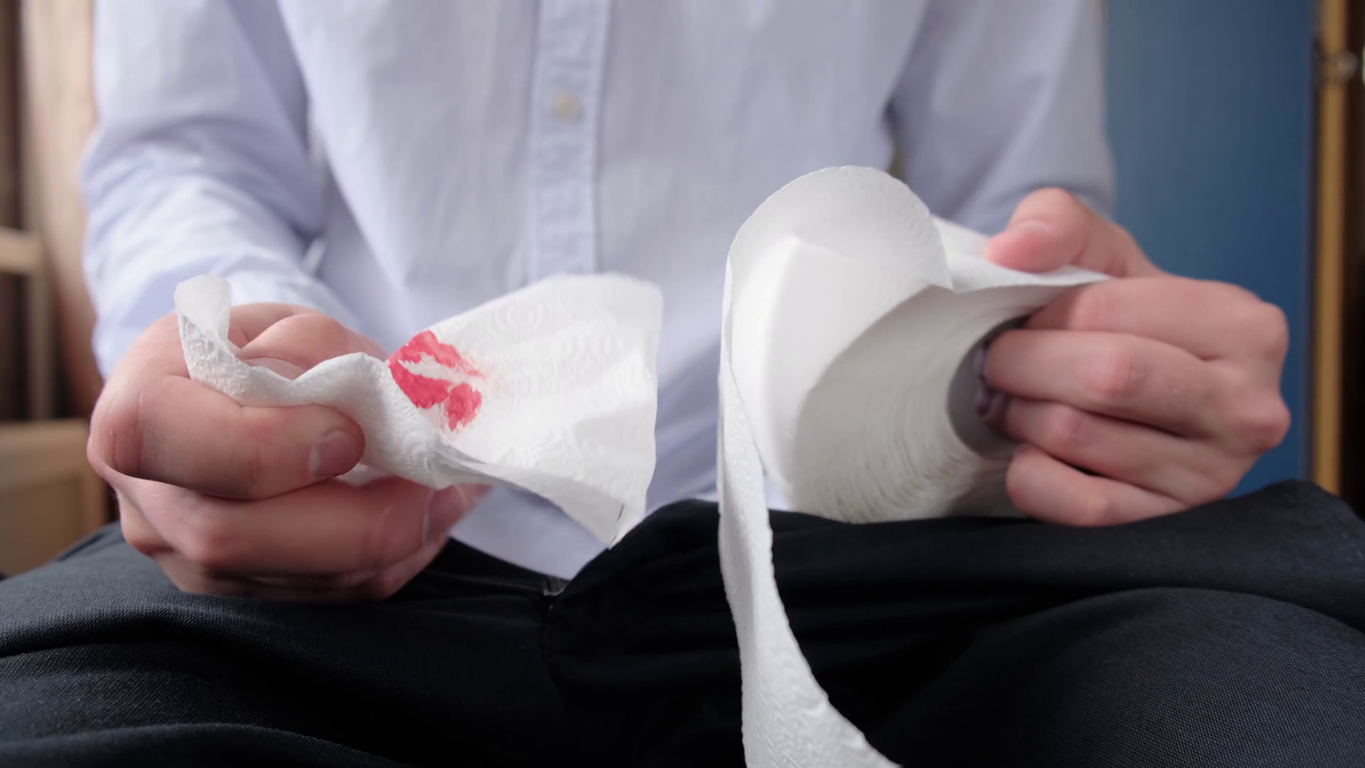 A Man Squeezes Toilet Paper In His Hands Experiencing Pain From Hemorrhoids Stock Video Footage a-man-squeezes-toilet-paper-in-his-hands-experiencing-pain-from-hemorrhoids-stock-video-footage