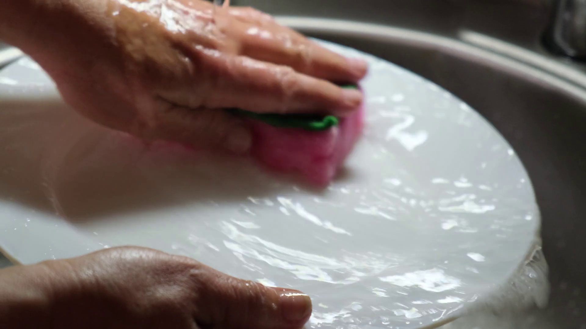 Housewife washes dishes in the kitchen, close-up Stock Video Footage ...