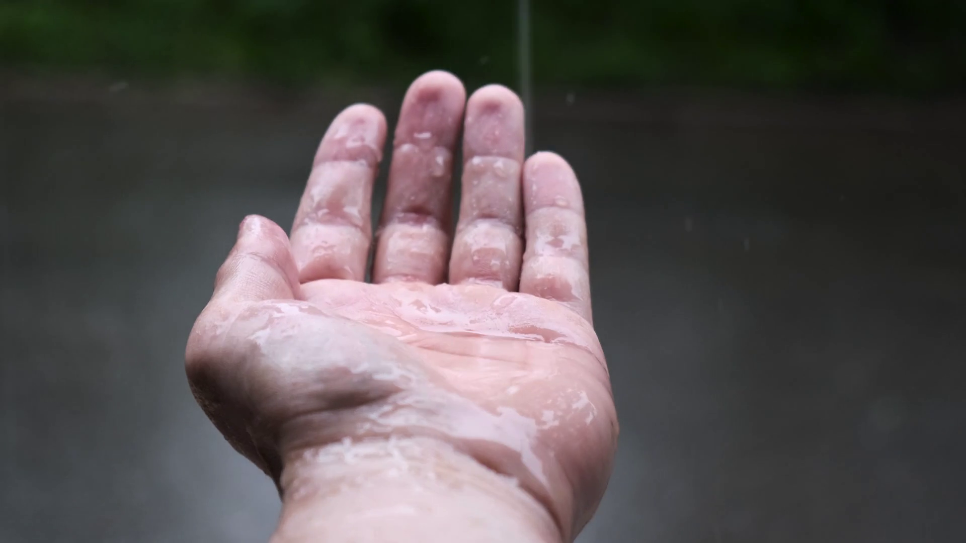 Rain Falls On Man's Hand Close Up Stock Footage SBV-335175412 - Storyblocks