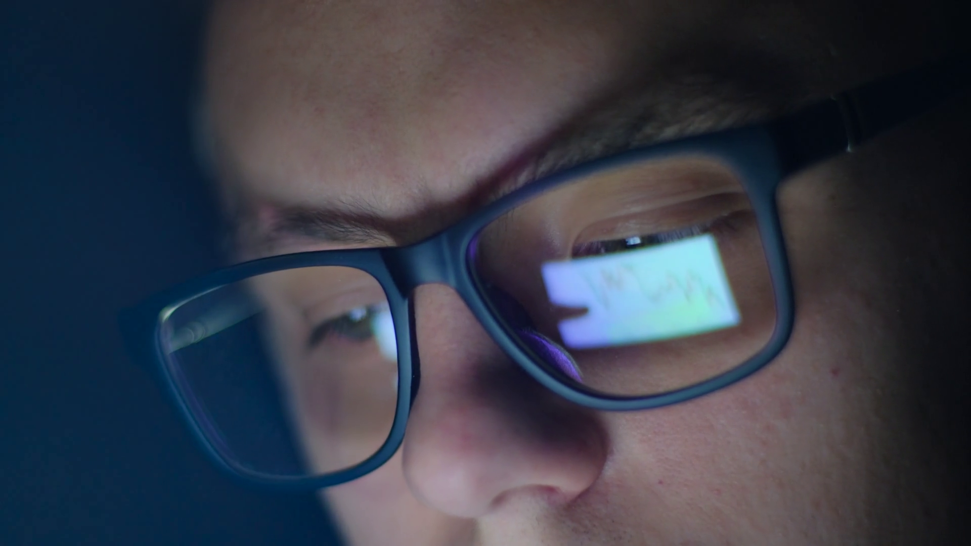 Reflection of a Smartphone Screen in man Glasses at Night. Businessman ...