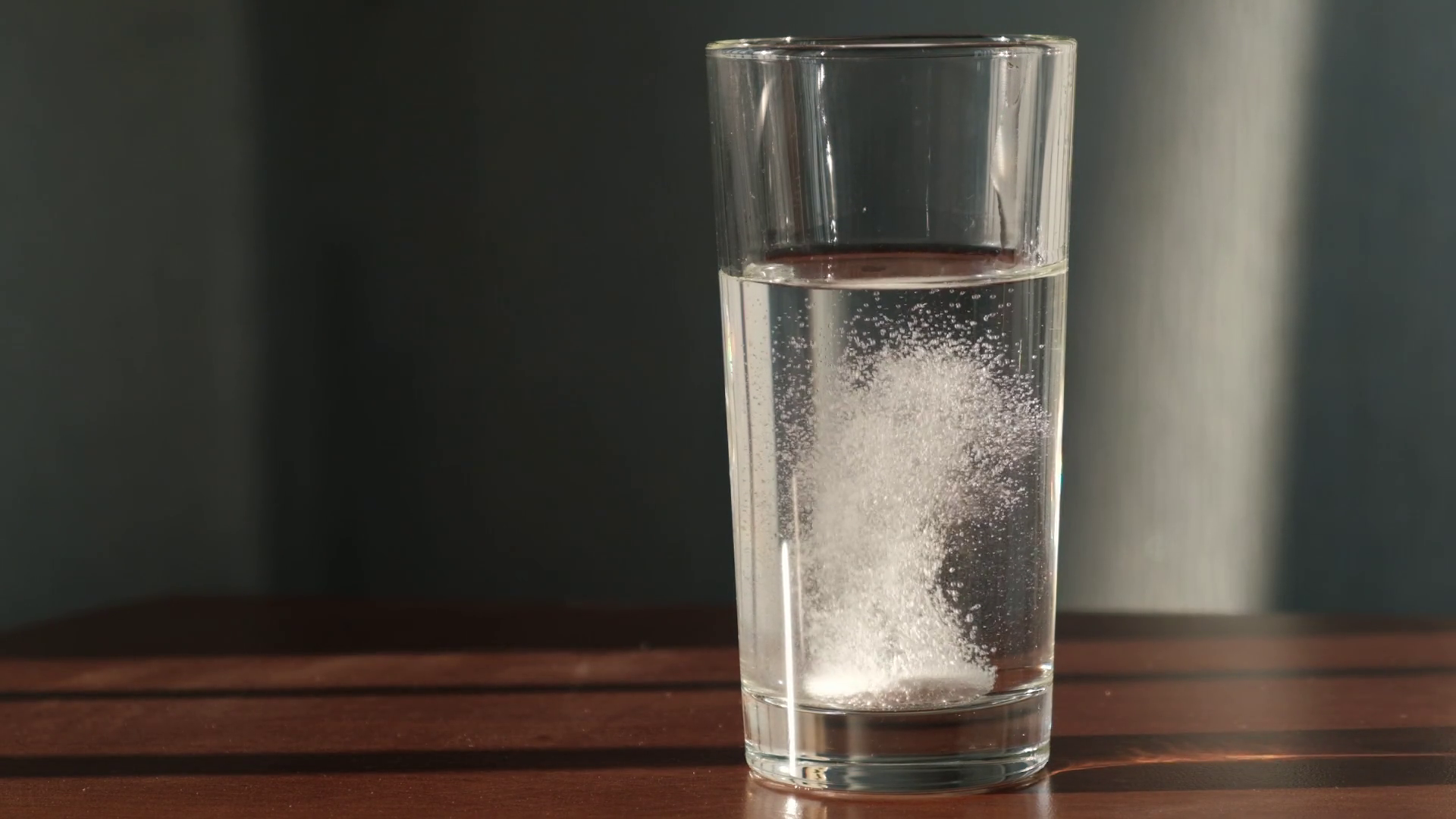Tablet Falling Into Glass Of Water Dissolves Stock Footage SBV ...