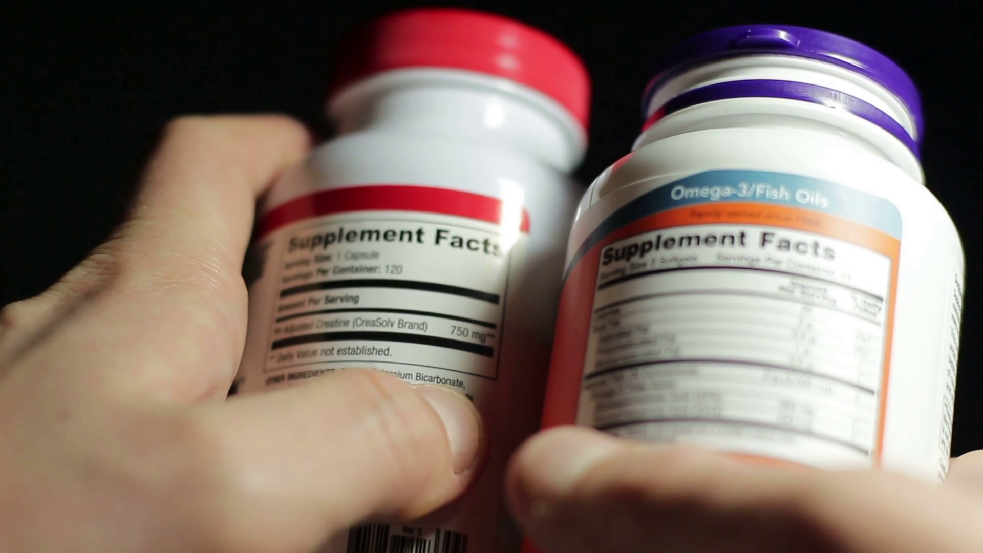 The athlete reads the food composition of sports supplements Stock ...