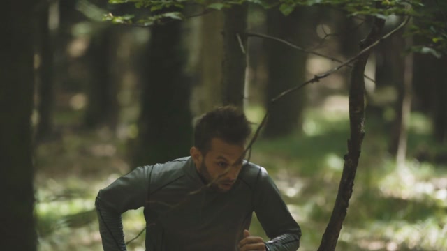 Man Running Through Forest Stock Footage: Royalty-Free Video Clips ...