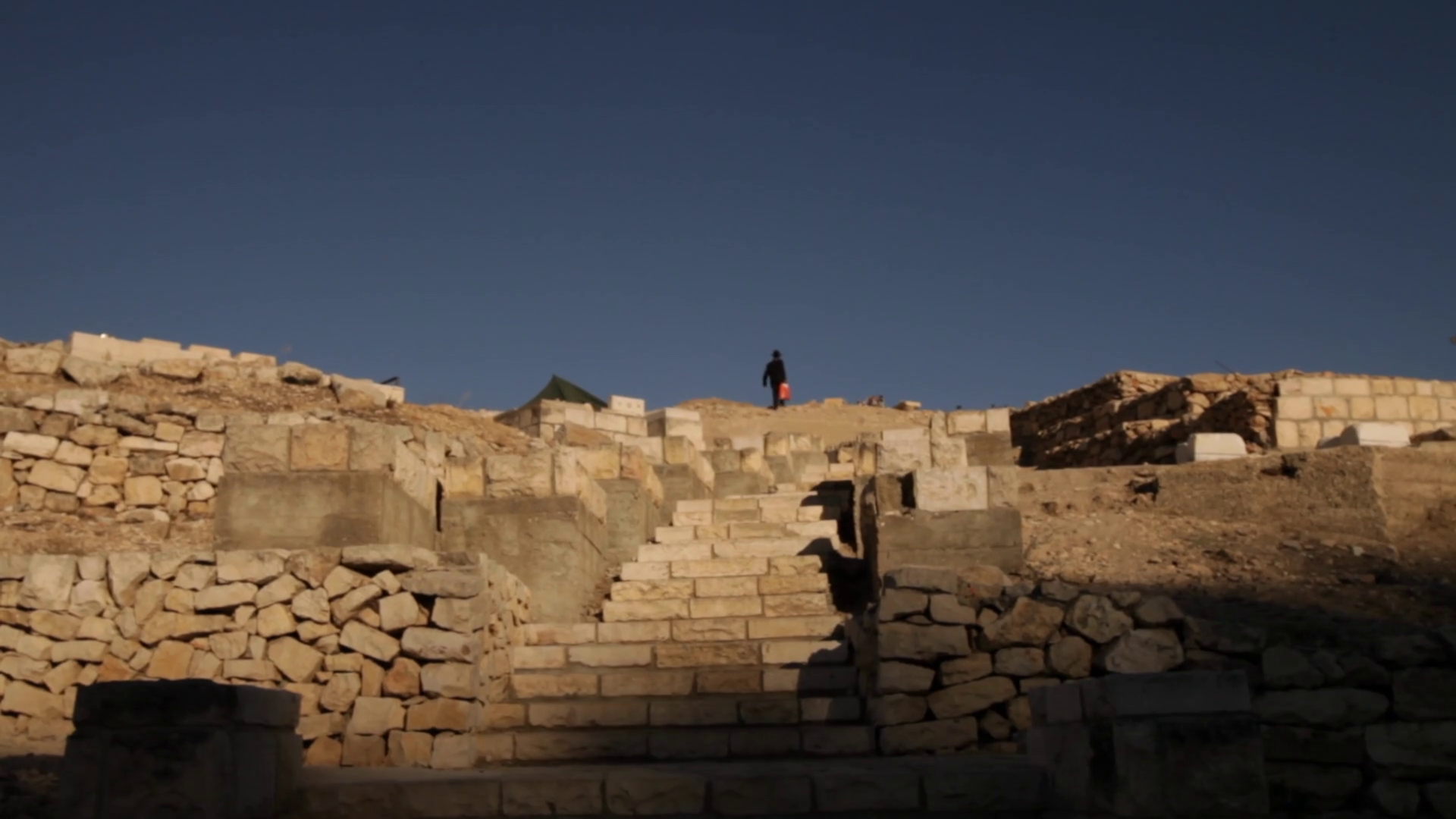 A Man Crests Top Of Cemetery At Edge Of Old Stock Footage SBV-324516468 ...
