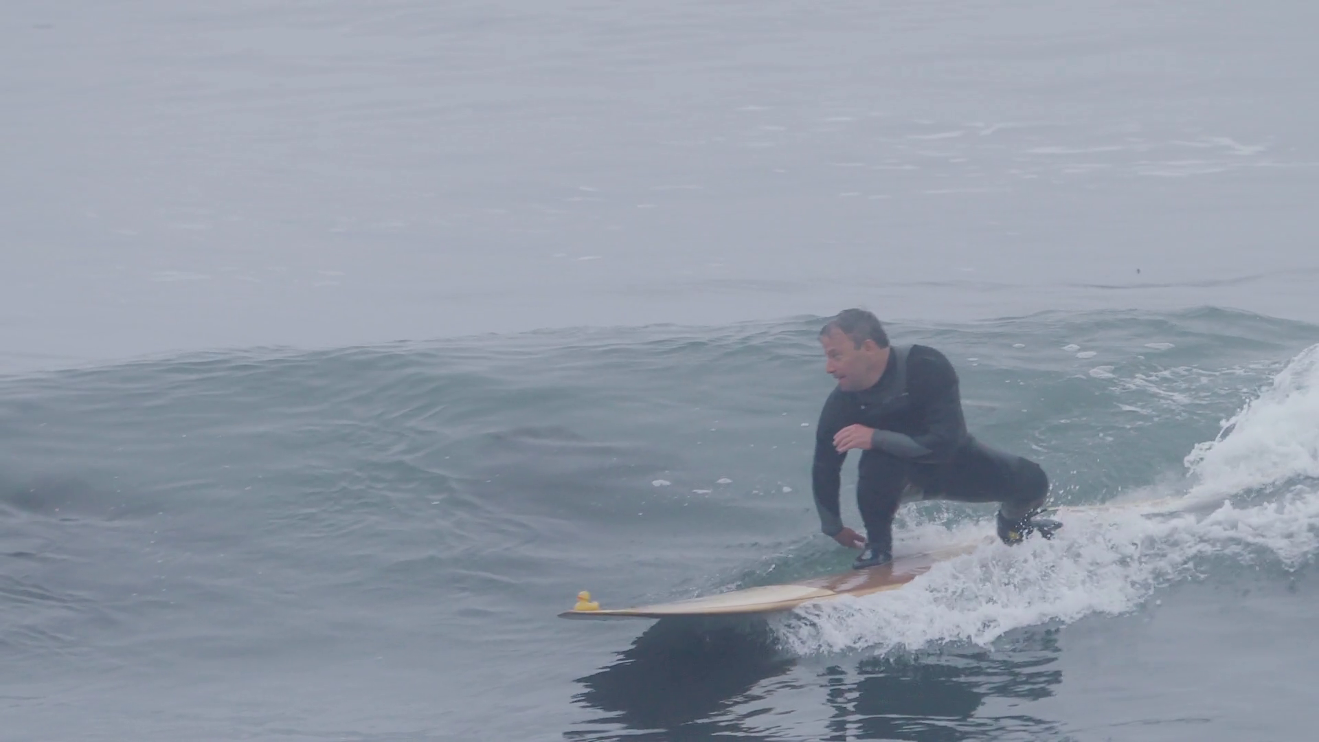 Surfer Rides Out Dying Wave On Cold Foggy Stock Footage SBV-328745695 ...