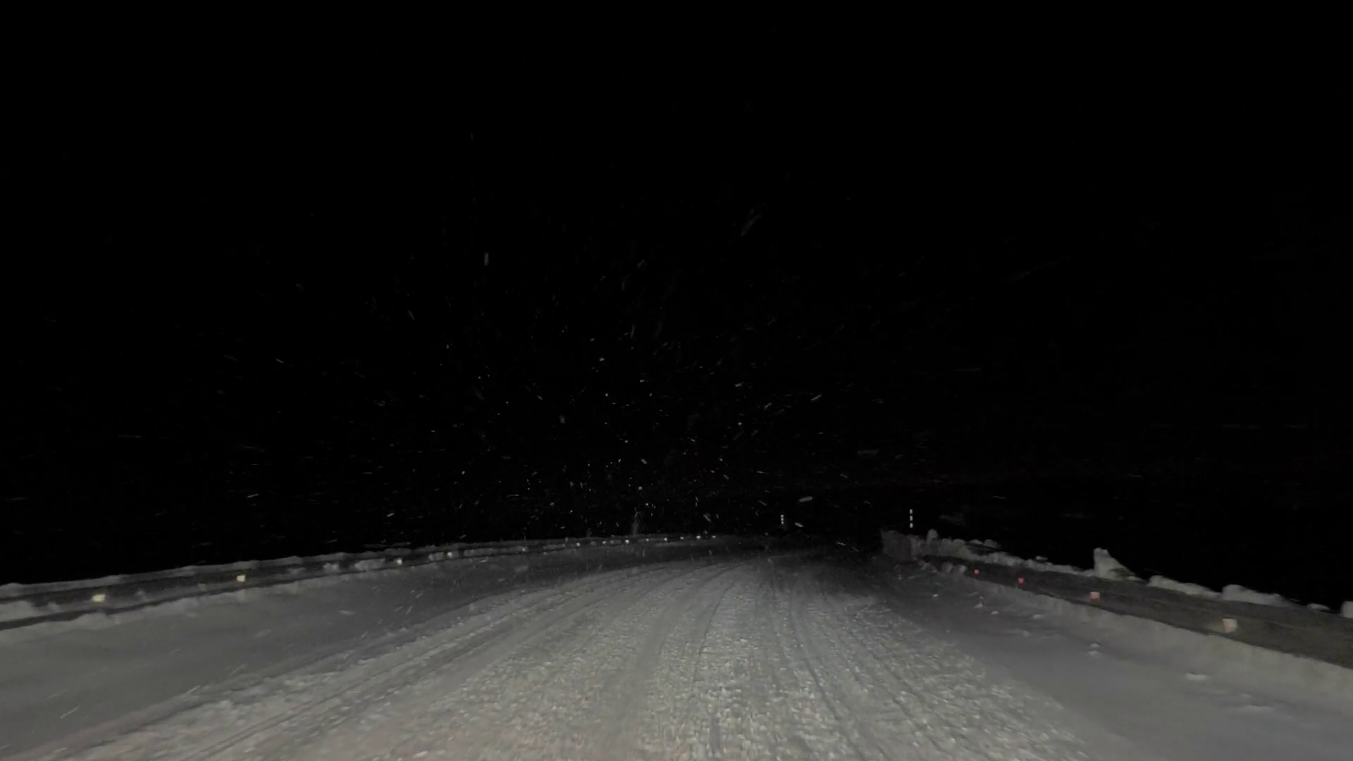 A Car Driving Down Road Through Snow Stock Footage SBV-348696055 ...