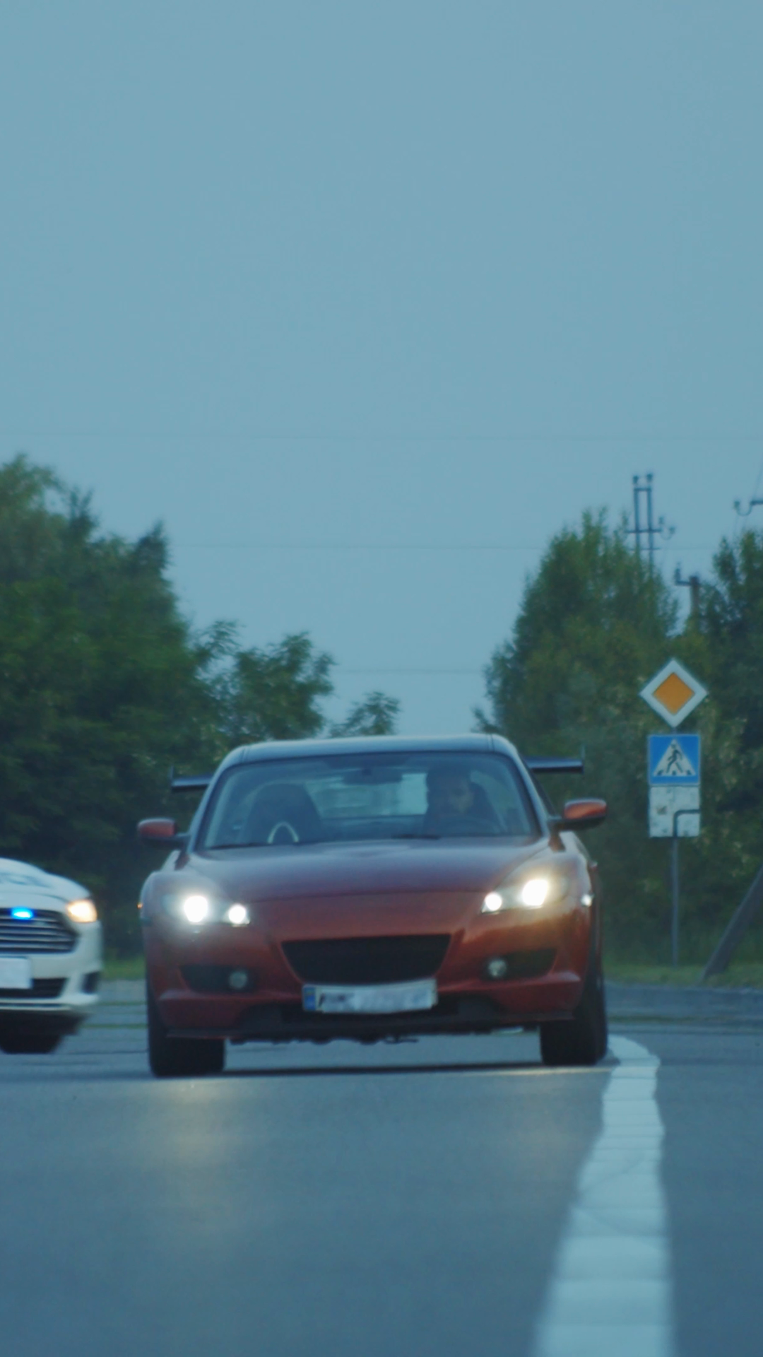 A Red Car Driving Alongside Busy Highway On Stock Footage SBV-353139985 ...