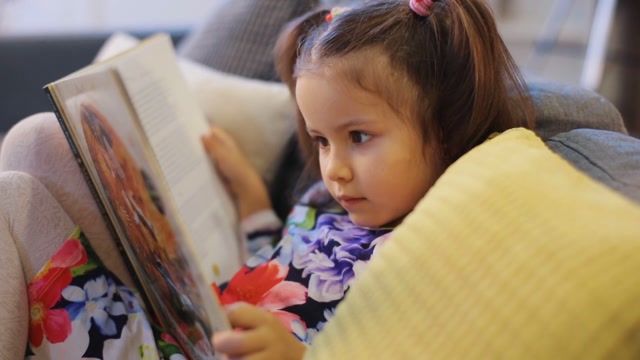 Little Girl Reading Book Stock Footage: Royalty-Free Video Clips ...