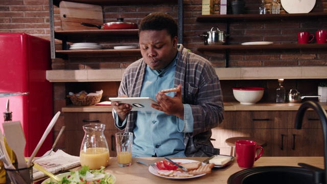 Tablet Eating Stock Footage: Royalty-Free Video Clips - Storyblocks