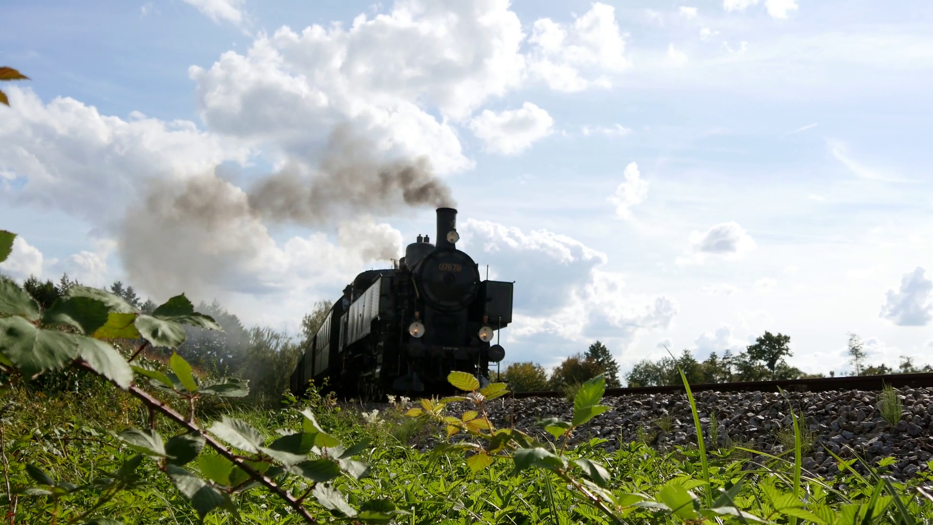 old historical steam engine locomotive train driving on railroad ...