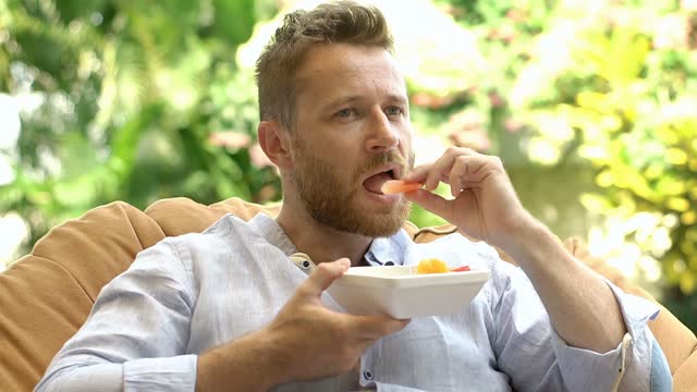 Man Eating Fruits Stock Footage: Royalty-Free Video Clips - Storyblocks