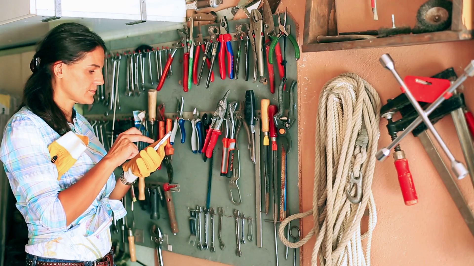 Woman Searching Tools Using Cellphone In Stock Footage SBV-301171356 ...