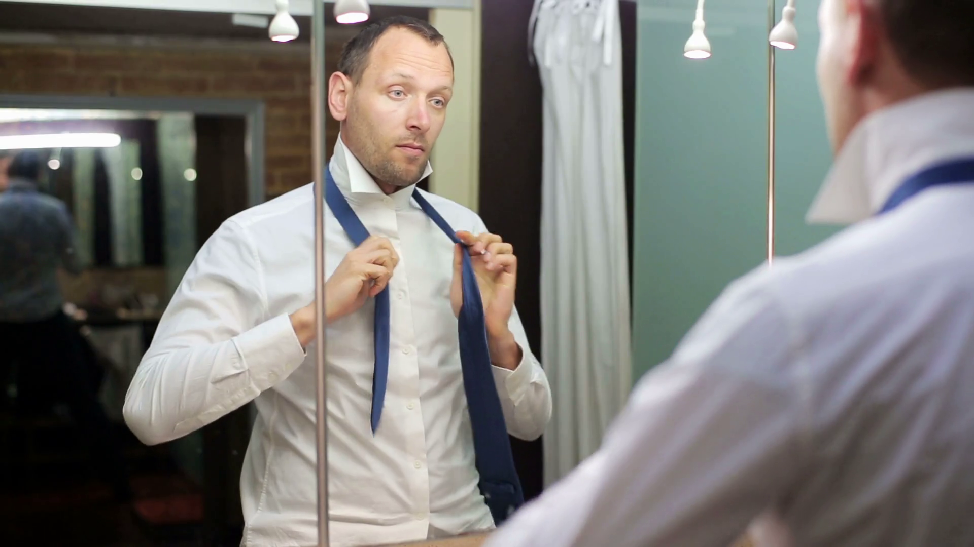 Young Businessman Tying Tie Looking In Mirror Stock Footage SBV ...