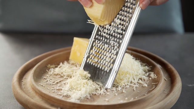 Grating Cheese Stock Footage: Royalty-Free Video Clips - Storyblocks