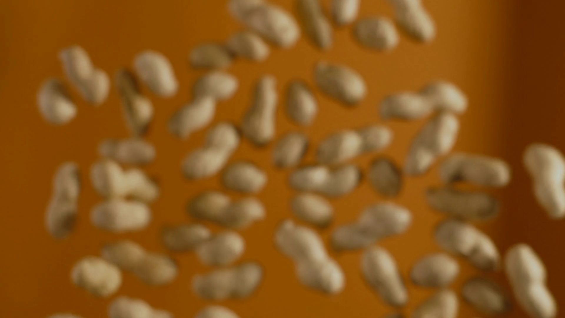 Falling Peanuts In Slow Motion On Orange Stock Footage SBV-337718545 ...