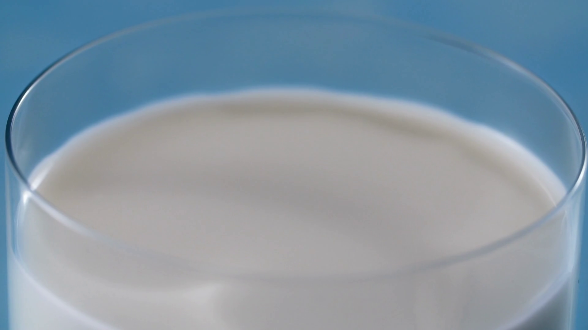 The Drop Of Milk Drips To Full Glass In Slow Stock Footage SBV ...