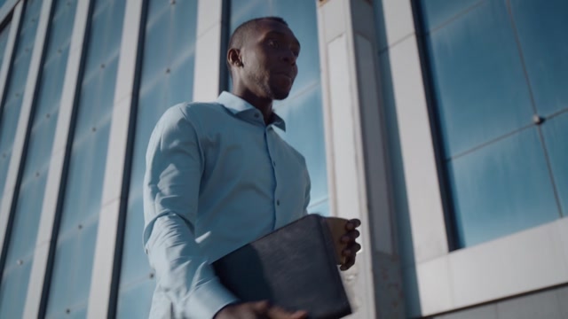 African American Man Walking Into The Bank Stock Footage: Royalty-Free ...