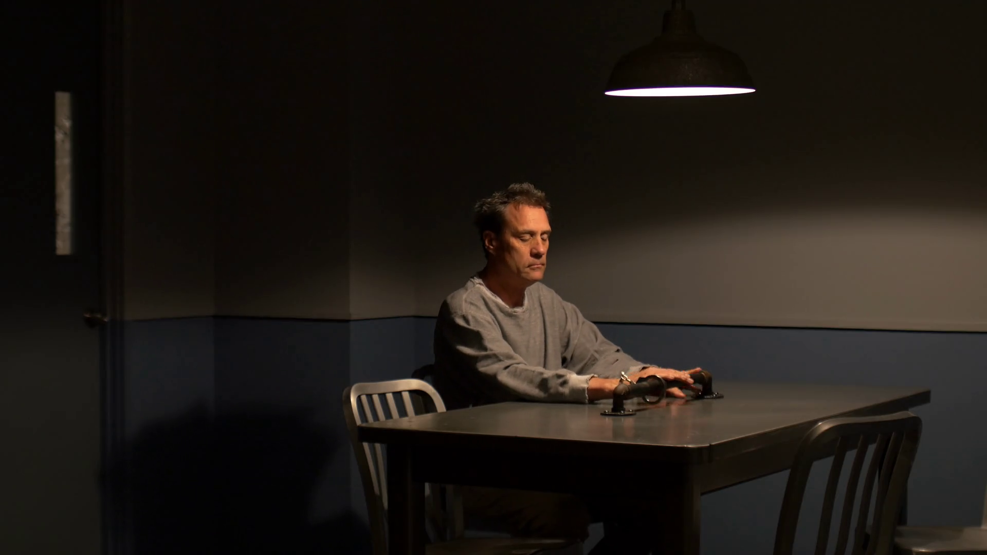 Man Awaits Interrogation Handcuffed To Table Stock Footage SBV-309855728 - Storyblocks