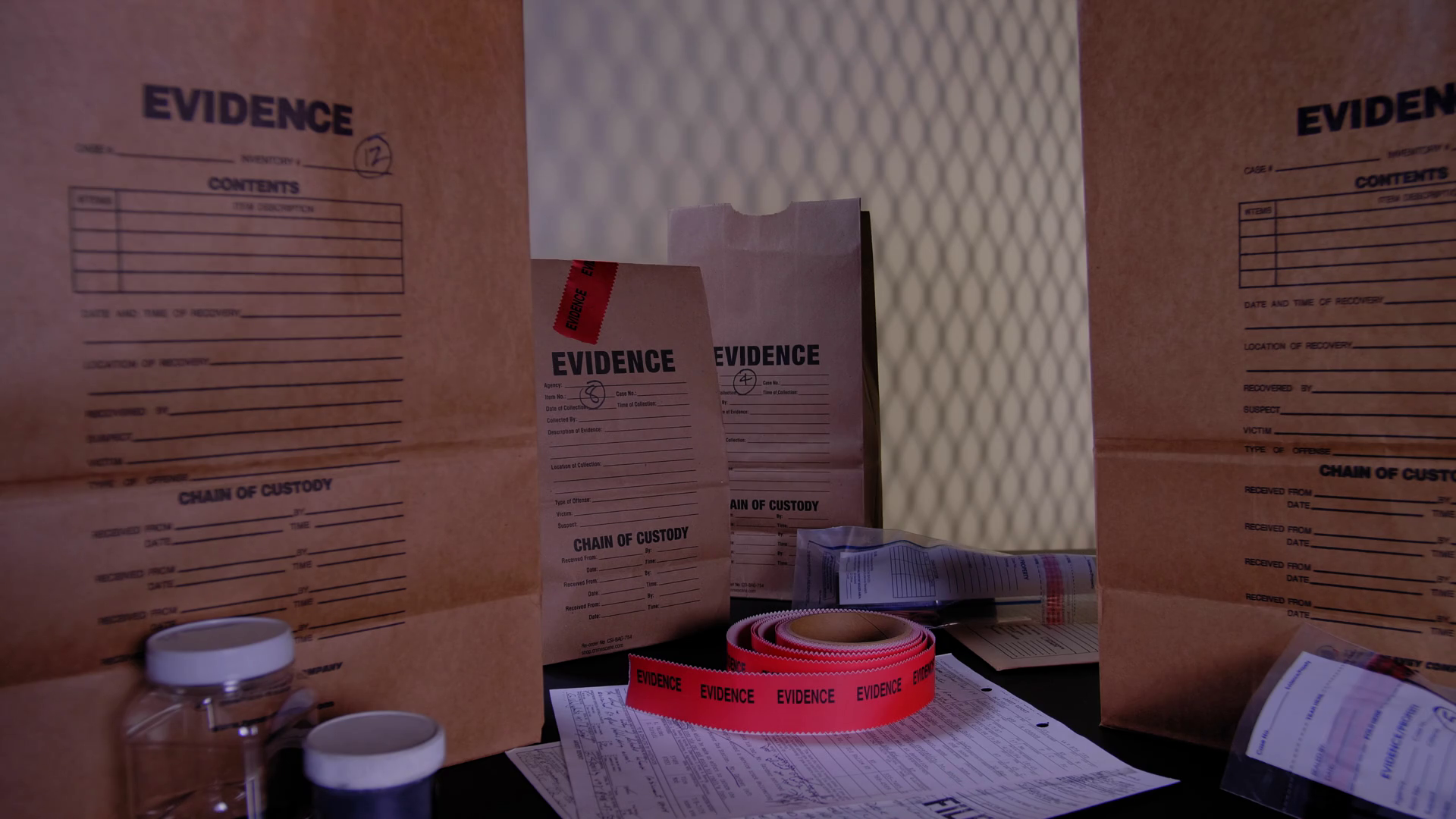 EVIDENCE COLLECTED AT A CRIME SCENE AWAIT INSPECTION INSIDE AN EVIDENCE ...