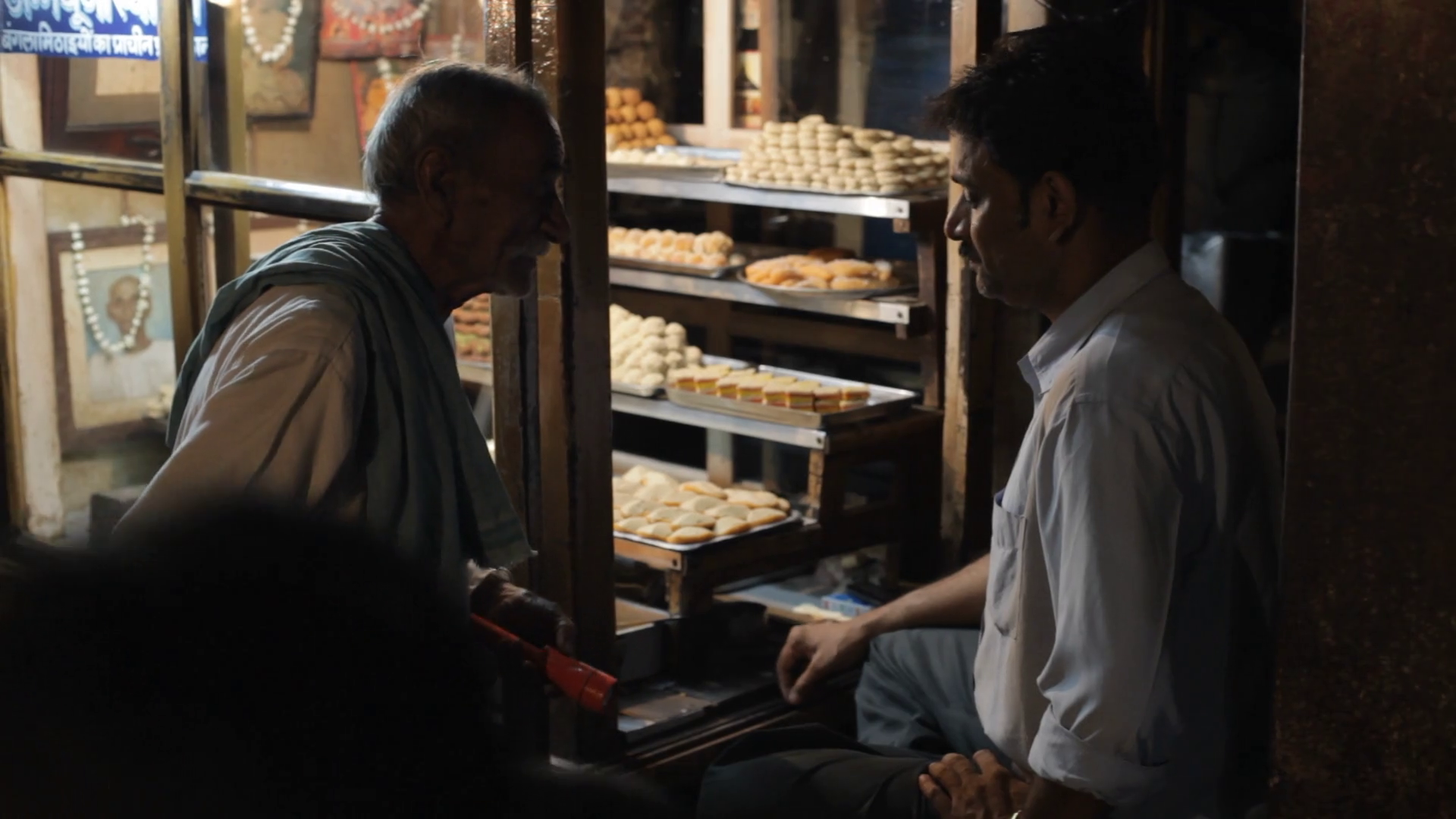 Ms Two Men Talking Outside Shop At Night / Stock Footage SBV-311402433 ...