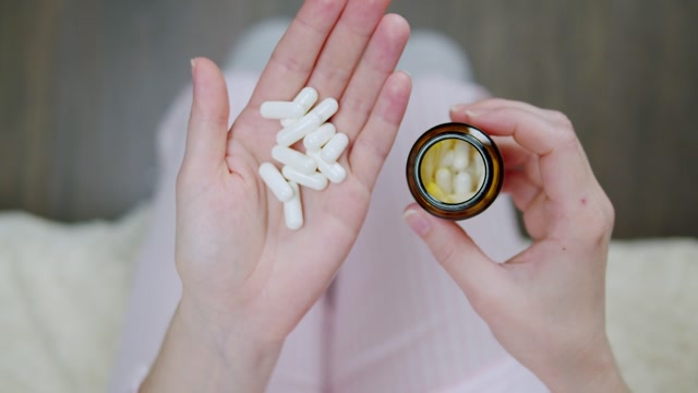 Woman Drinking Medicine Capsule Stock Footage: Royalty-Free Video Clips ...