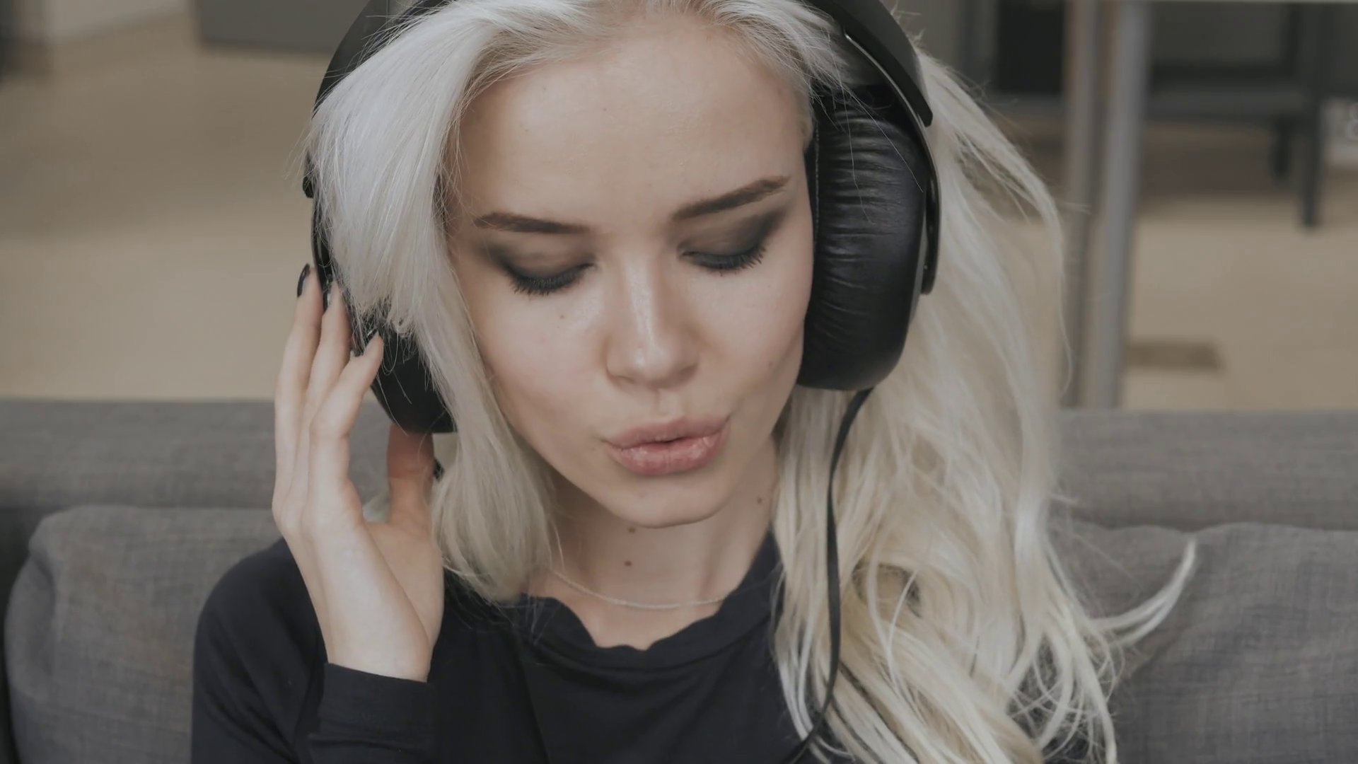 Blonde Girl Listening To Music