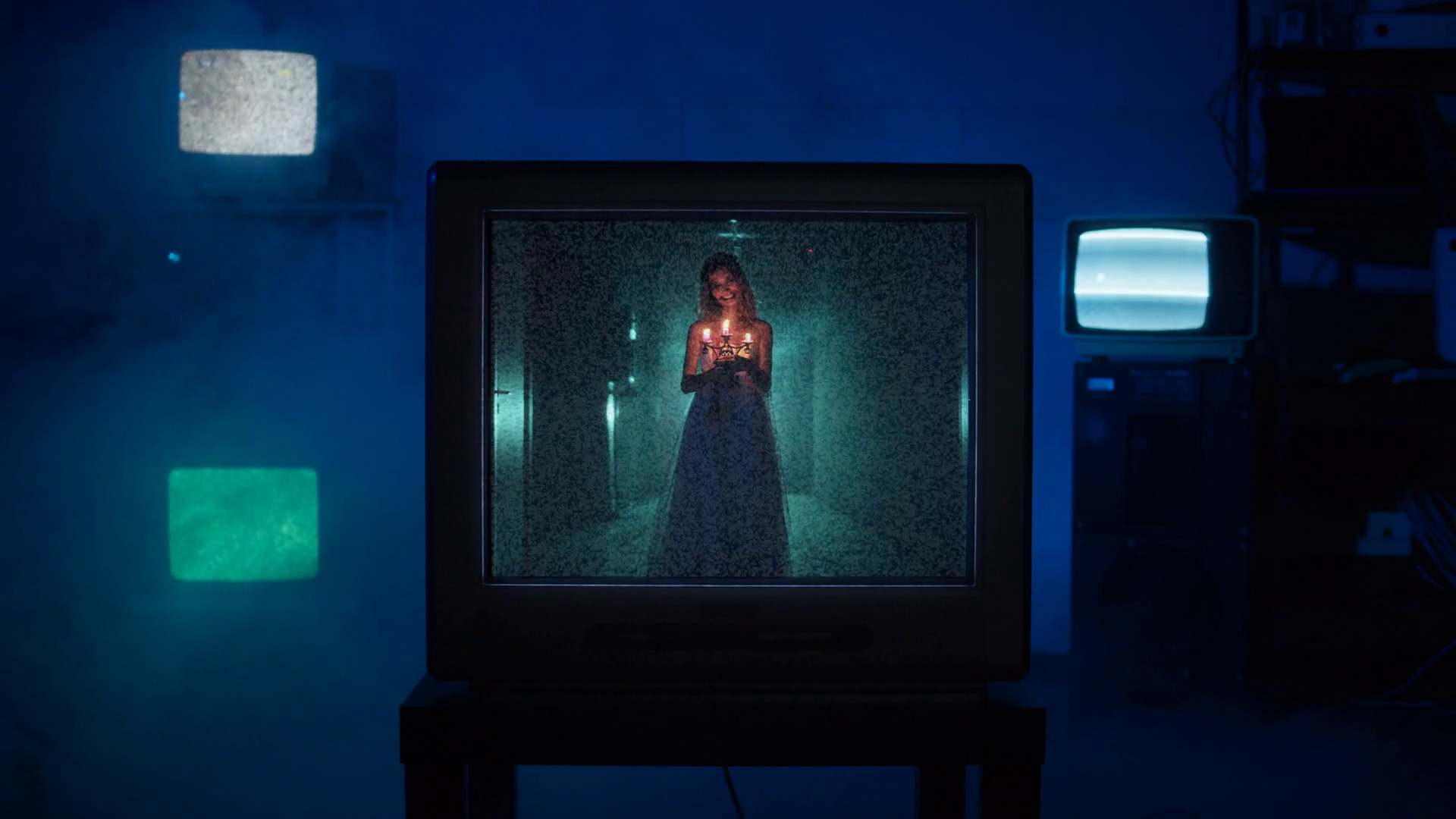 Old tv screen showing zombie woman holding burning candles close-up ...