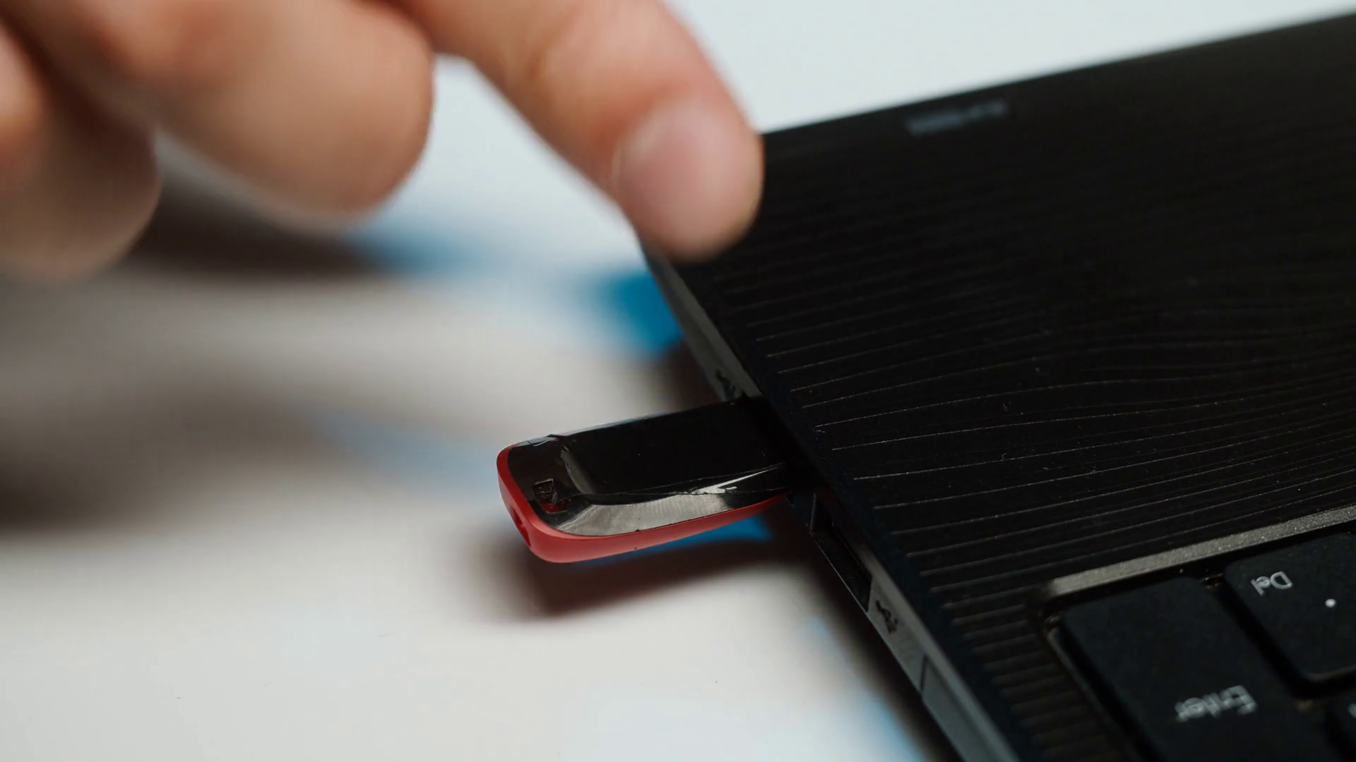 Using flash drive close-up, stealing information with usb from laptop ...