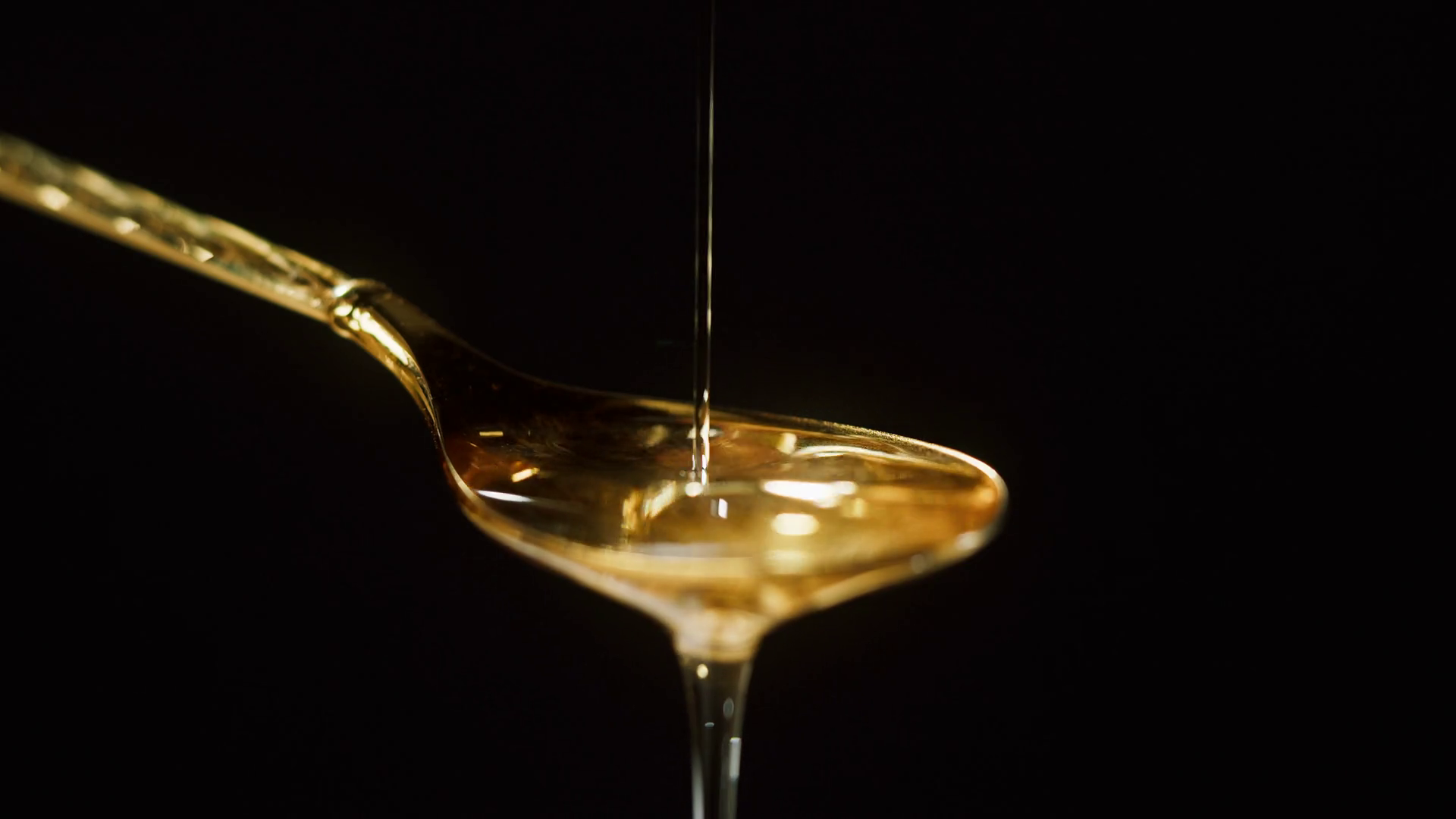 Dripping Oil Into Golden Spoon Close-up Stock Footage SBV-346734616 ...