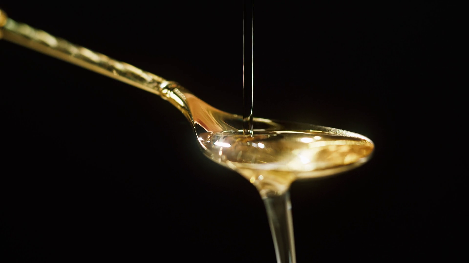 Dripping Oil Into Golden Spoon Close-up Stock Footage SBV-346734220 ...
