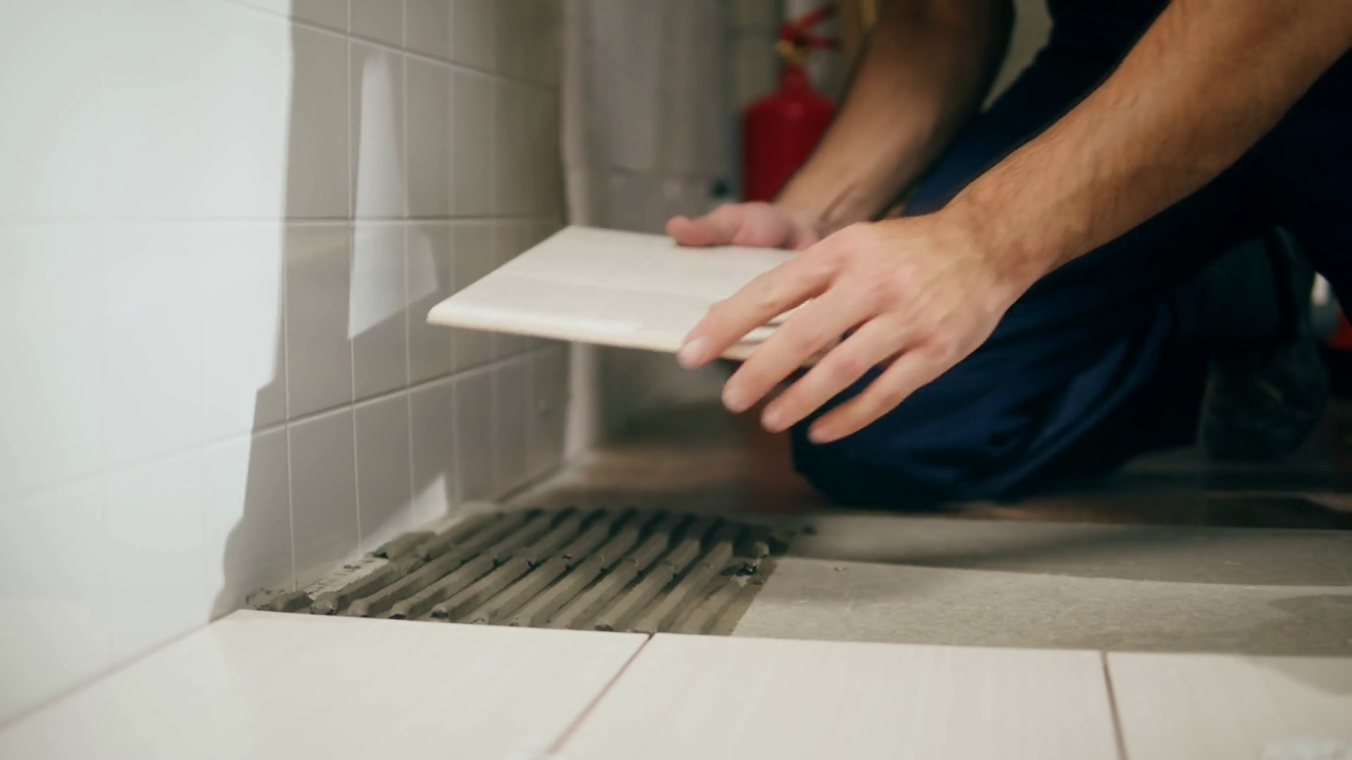 Builder Laying Tiles Using Cement Close-up Stock Footage SBV-346749236 ...