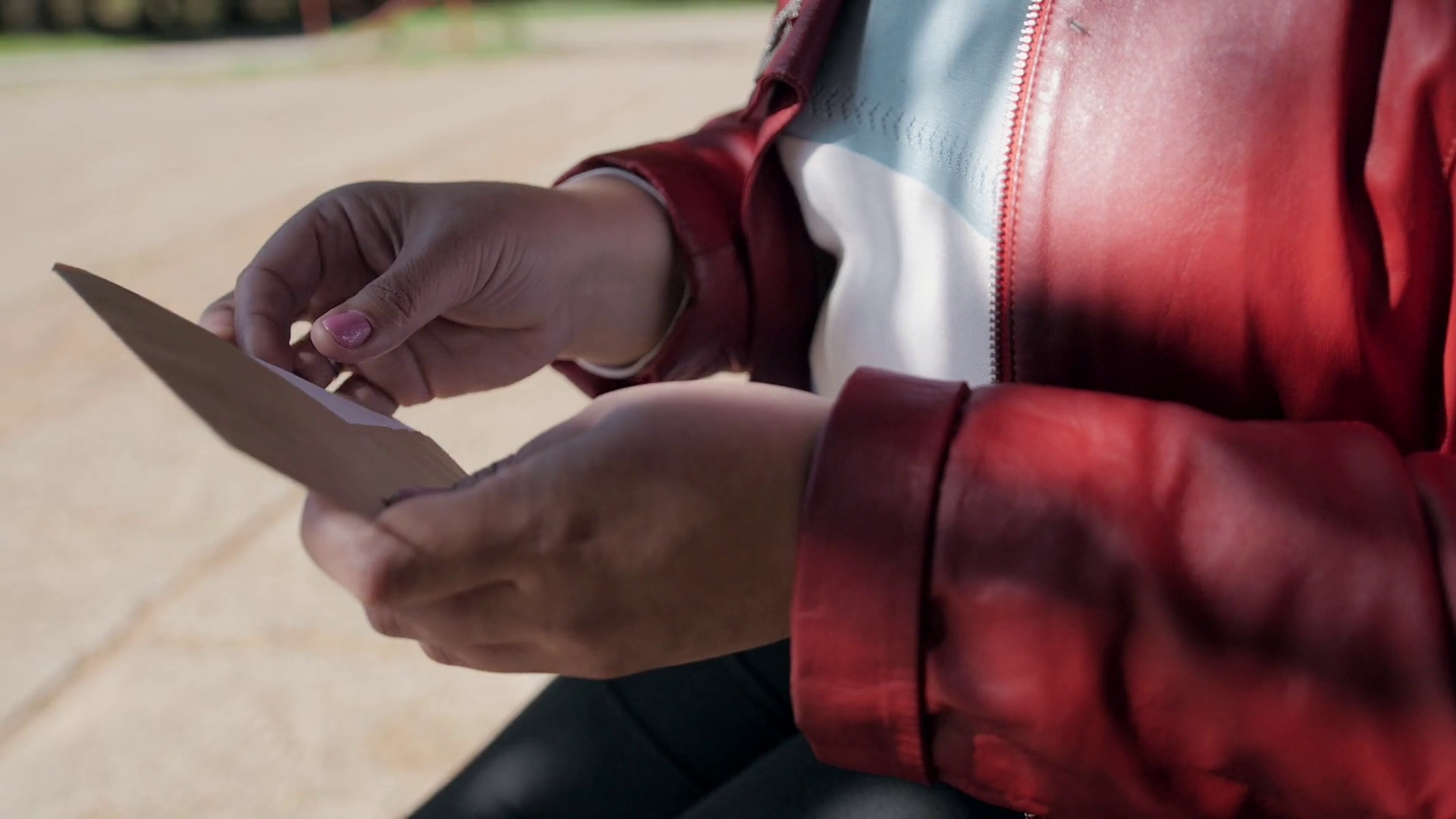 Unexpected letter. Close-up image of woman opening an envelope while ...
