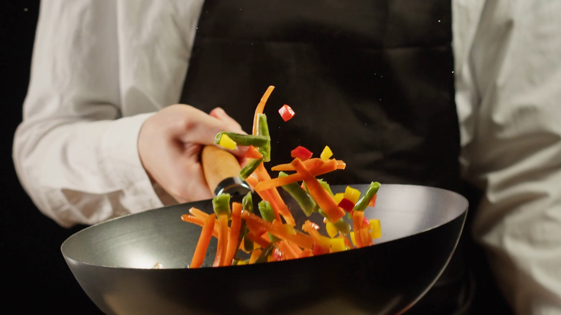 Chef Cooking Flambe Vegetables Mix On Wok Stock Footage SBV-348800609 ...