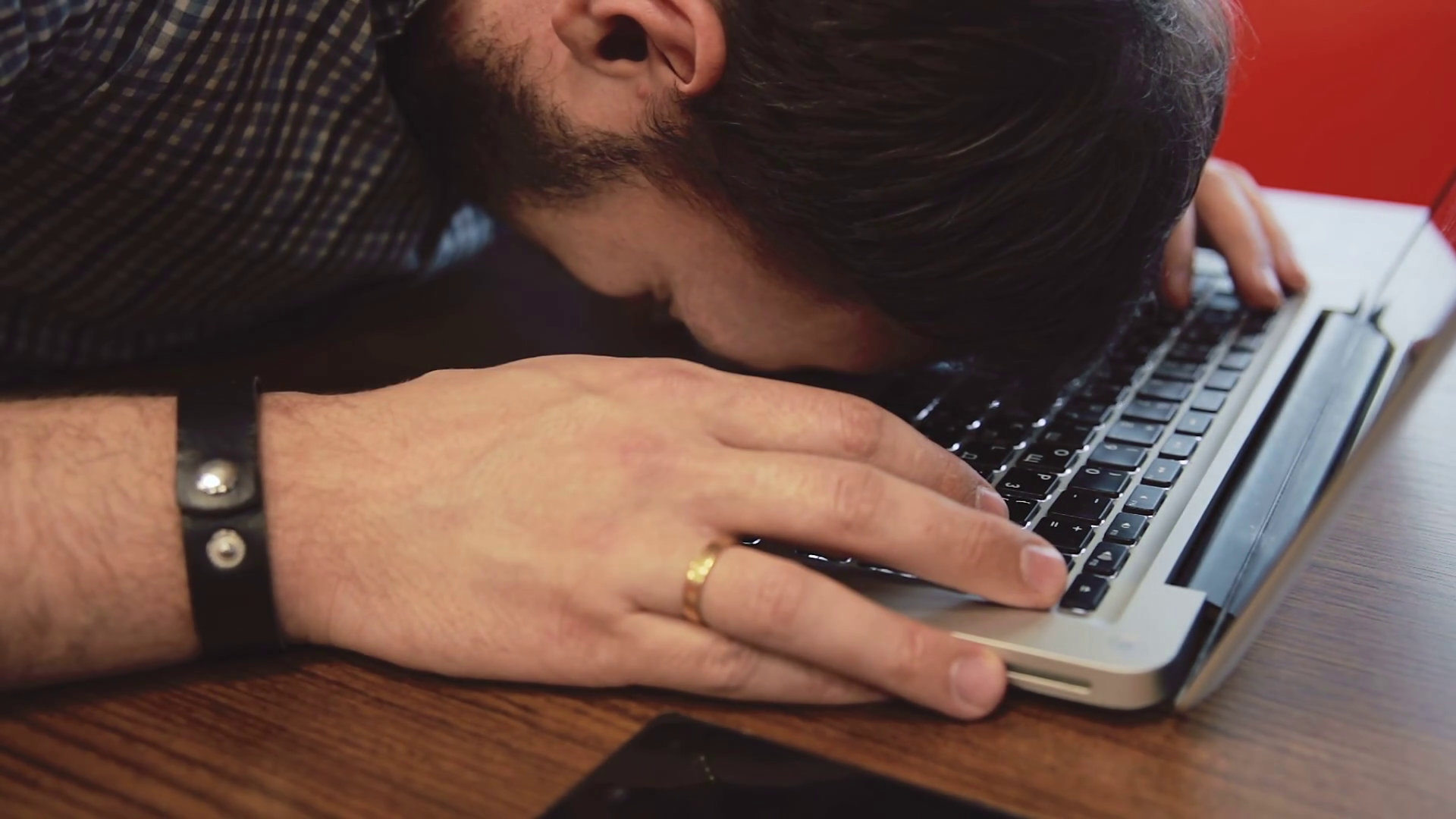 Upset man bangs his head on the laptop keyboard Stock Video Footage ...