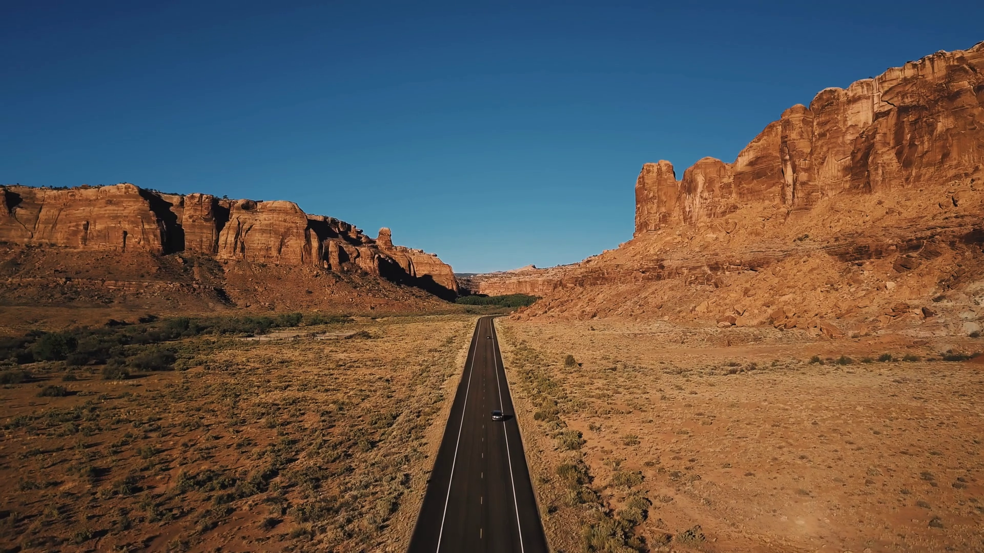 Aerial Shot Of Car Driving Along Straight Stock Footage SBV-327660867 ...