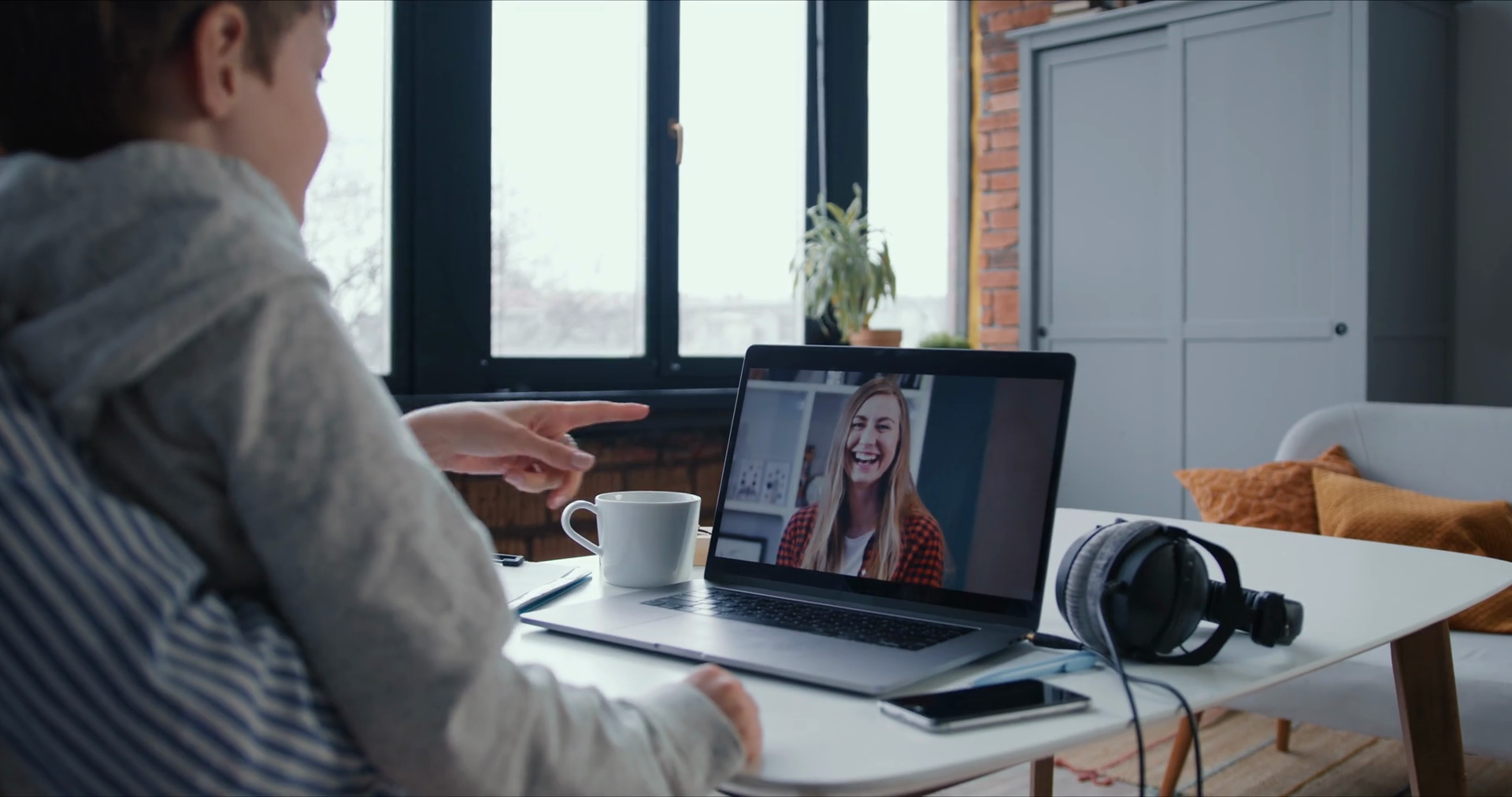 Video conference call concept. Excited young blonde woman smiles from ...