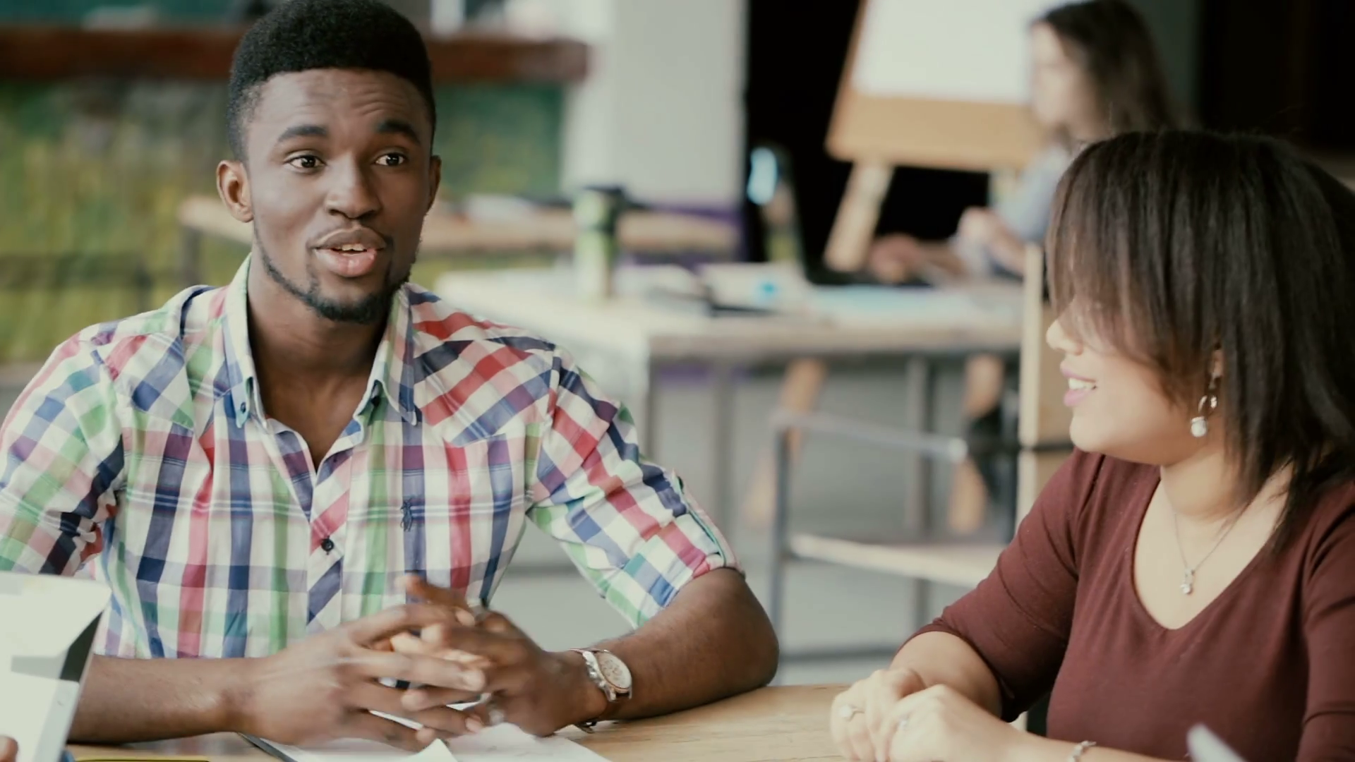 Young mixed race group of people have a conversation in modern office ...