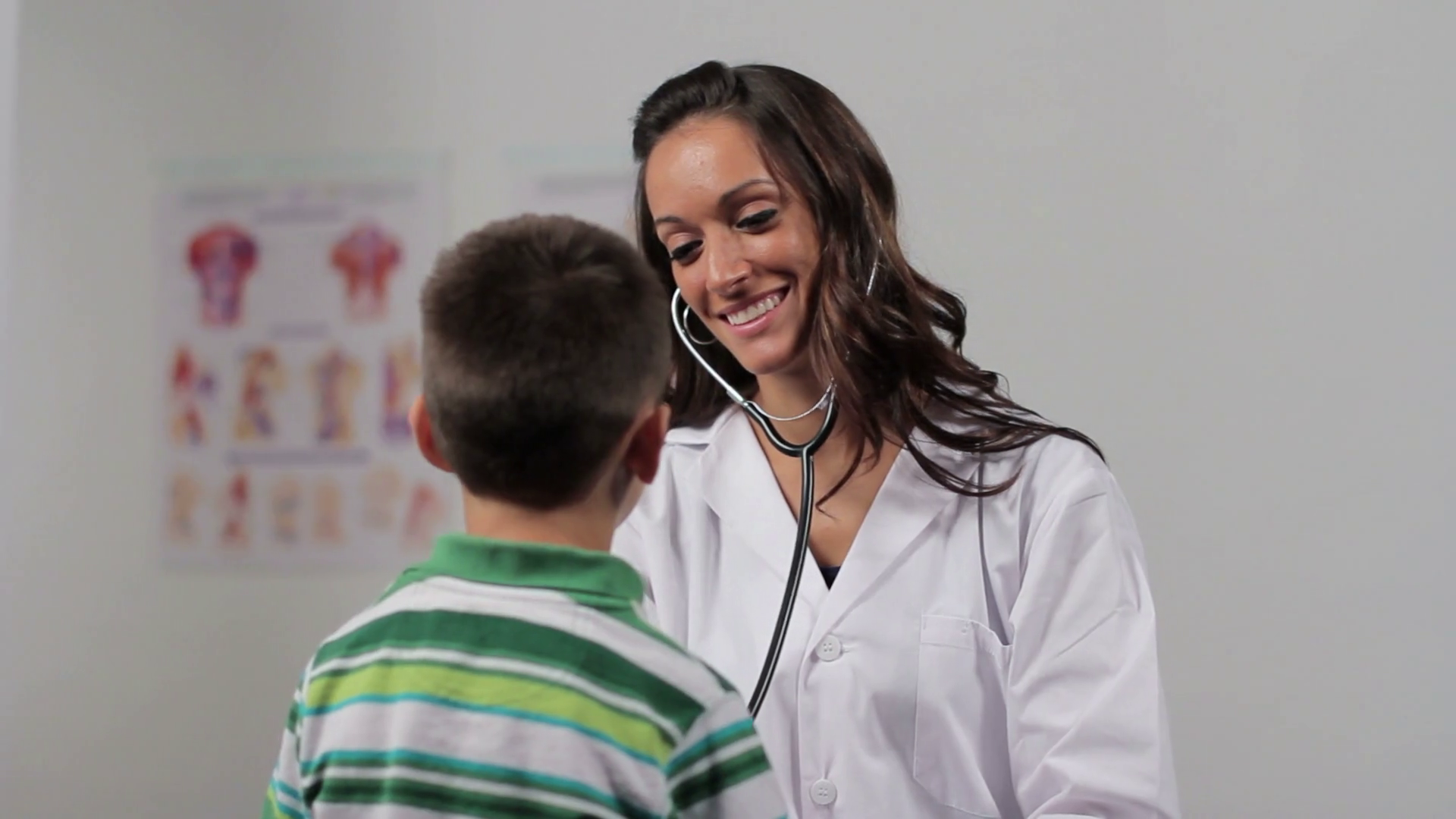A Female Doctor With Child Taking Heart Rate Stock Footage SBV ...