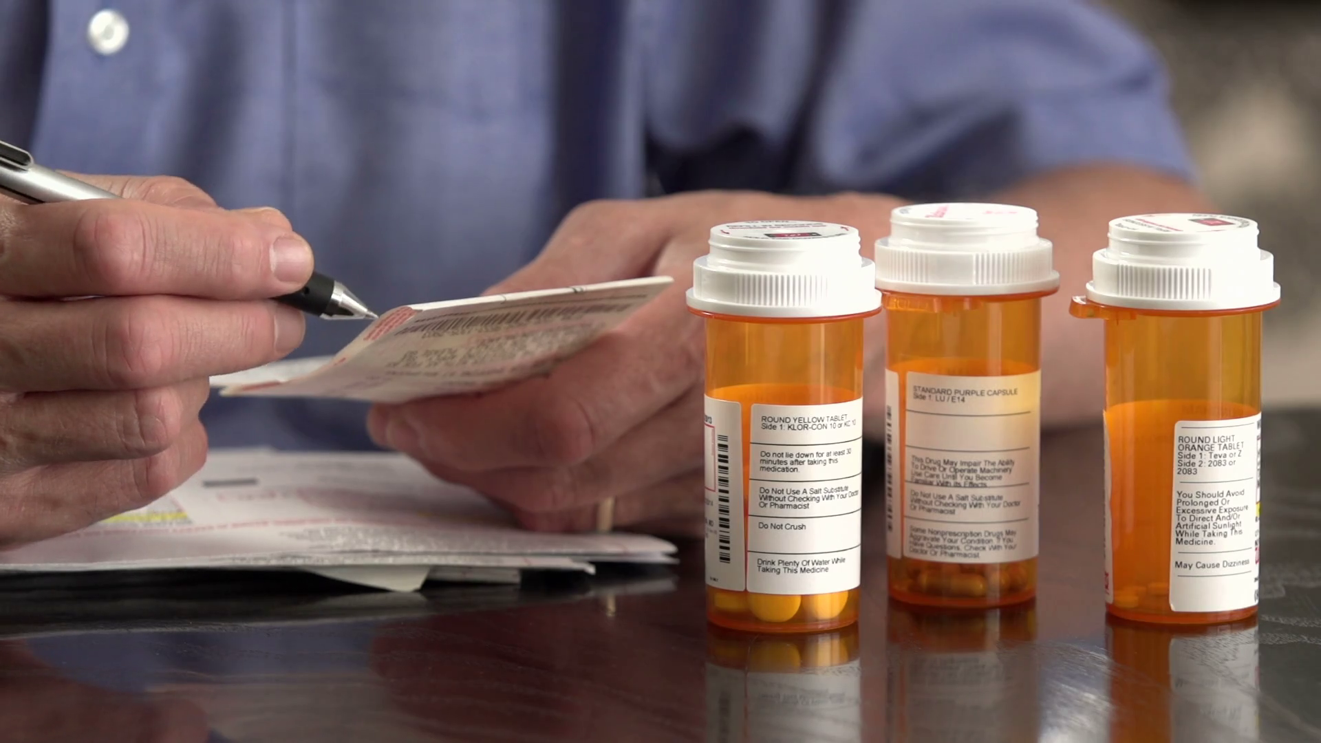 A Man Looks Over Medical Prescriptions Close Stock Footage SBV ...