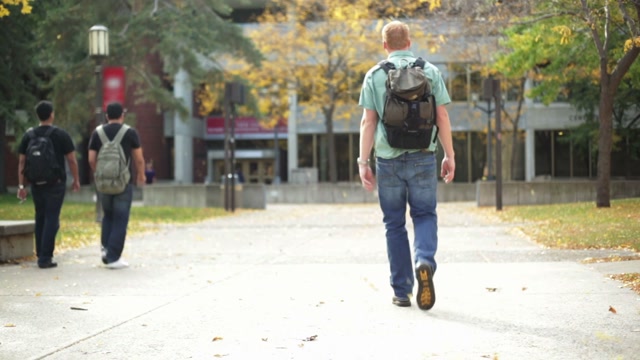 Student Walking On Campus Stock Footage: Royalty-Free Video Clips ...