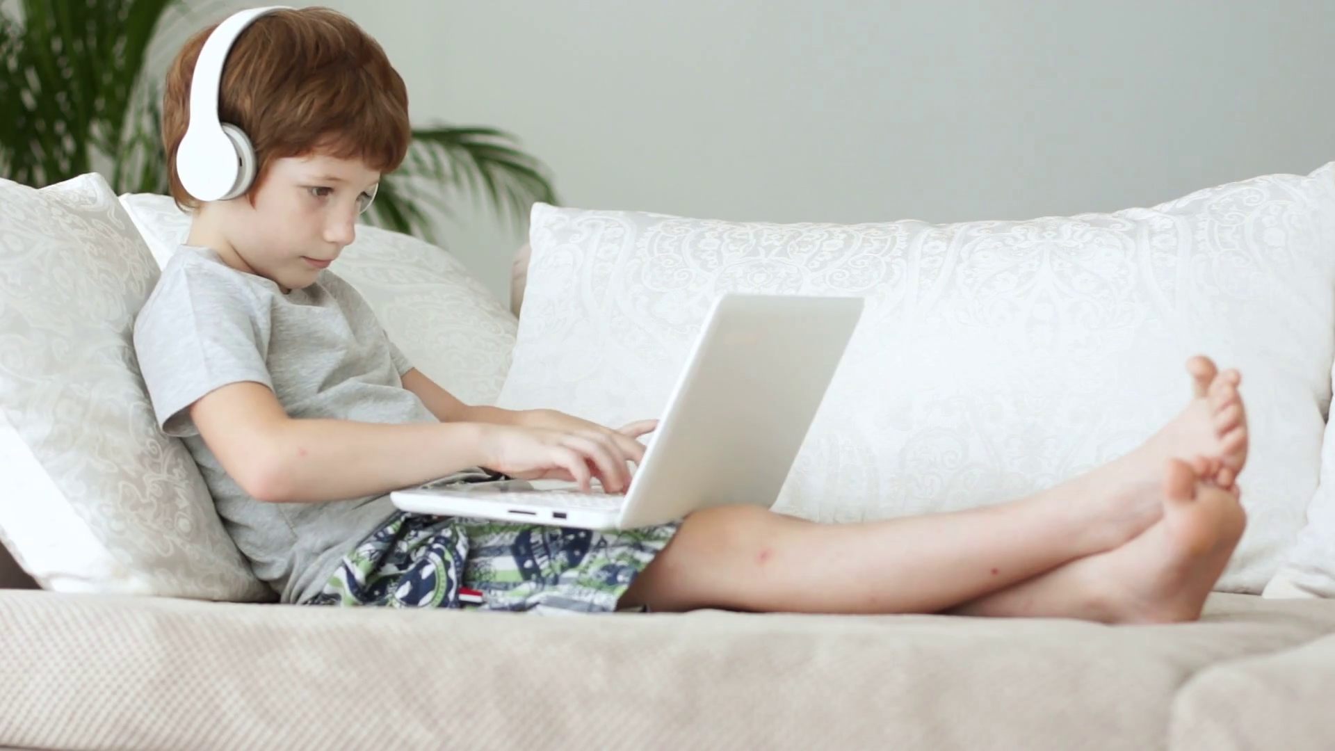 Joyful Boy On Sofa With Laptop Sharing Stock Footage SBV-303981101 ...