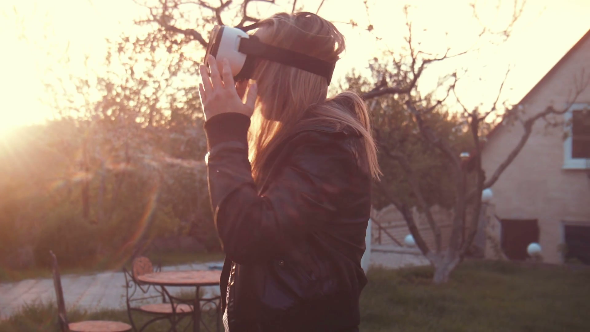 Girl uses head mounted display Oculus Rift outdoor at home. Stock Video ...