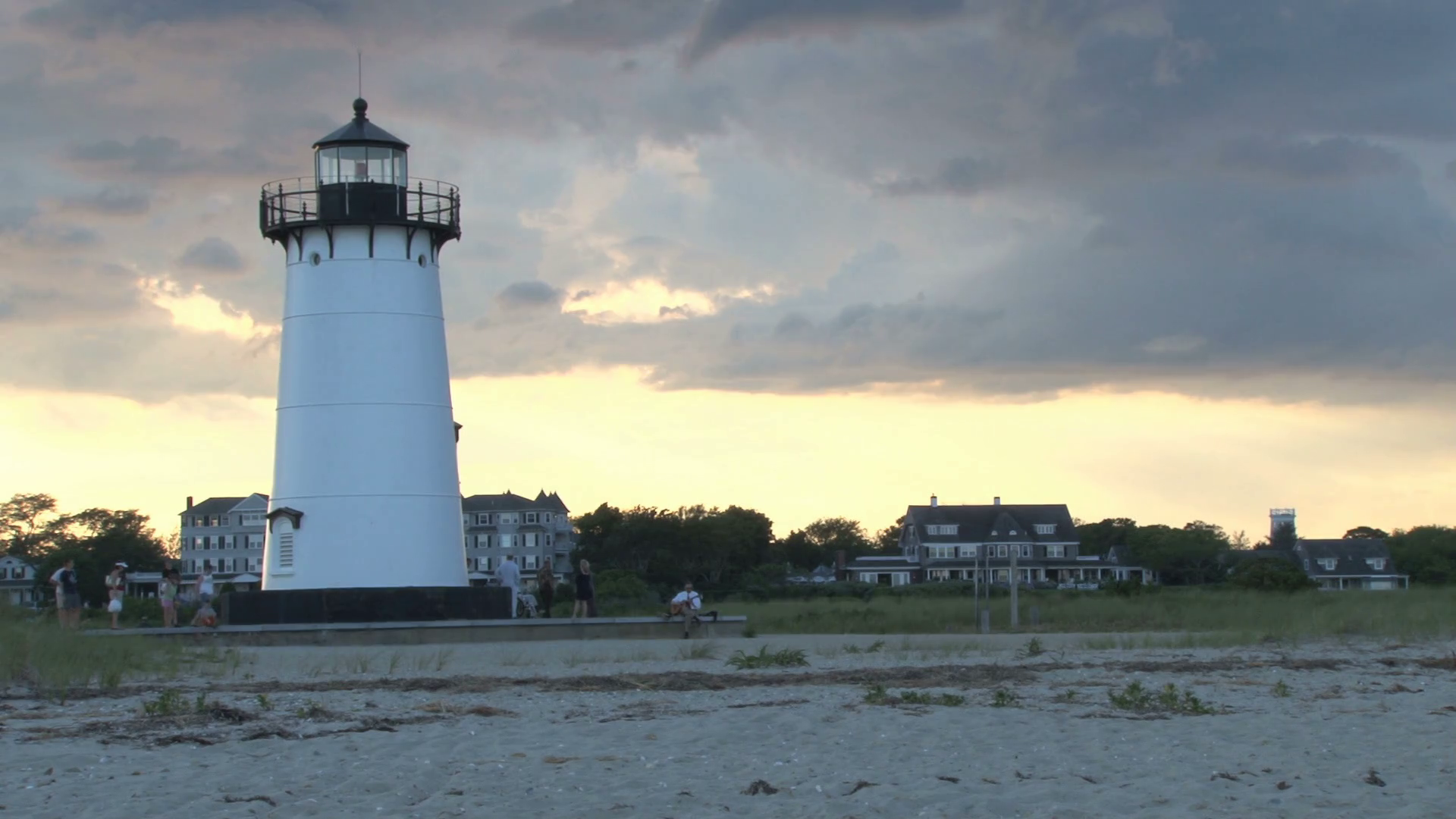 Lighthouse Beach Homes In Evening Stock Footage SBV-300100578 - Storyblocks