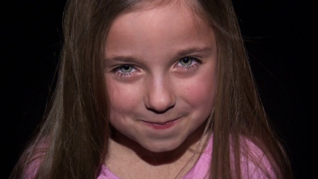 Little Girl Looking Into Camera Stock Footage: Royalty-Free Video Clips - Storyblocks