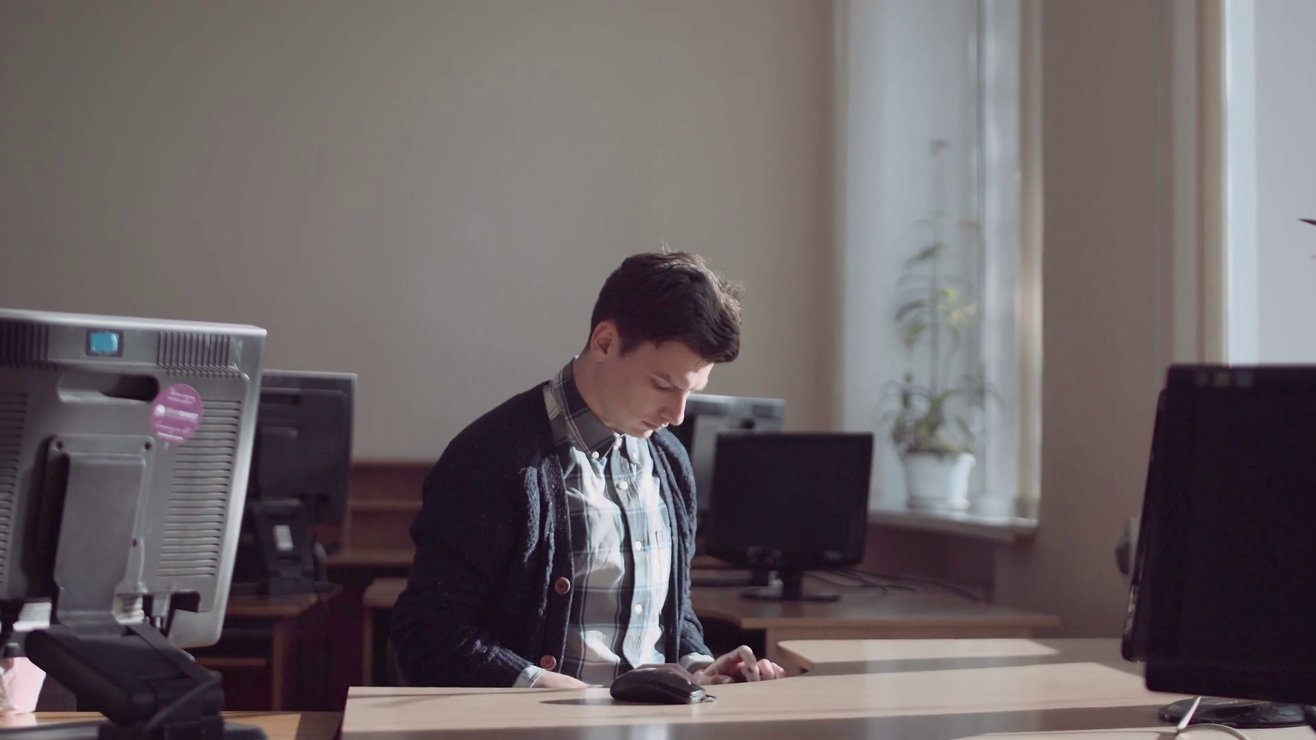 Man Sitting At Computer Woman Bringing Book Stock Footage SBV-312679511 ...