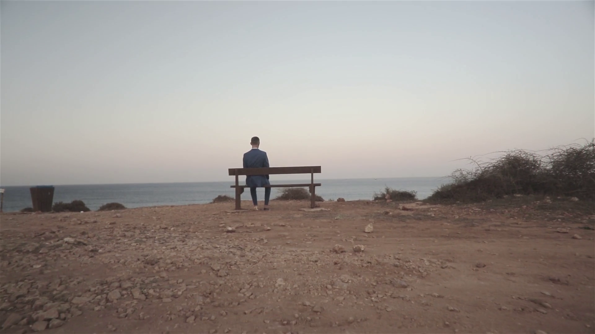 Man Sitting On Bench Facing Sea Stock Footage SBV-306148599 - Storyblocks