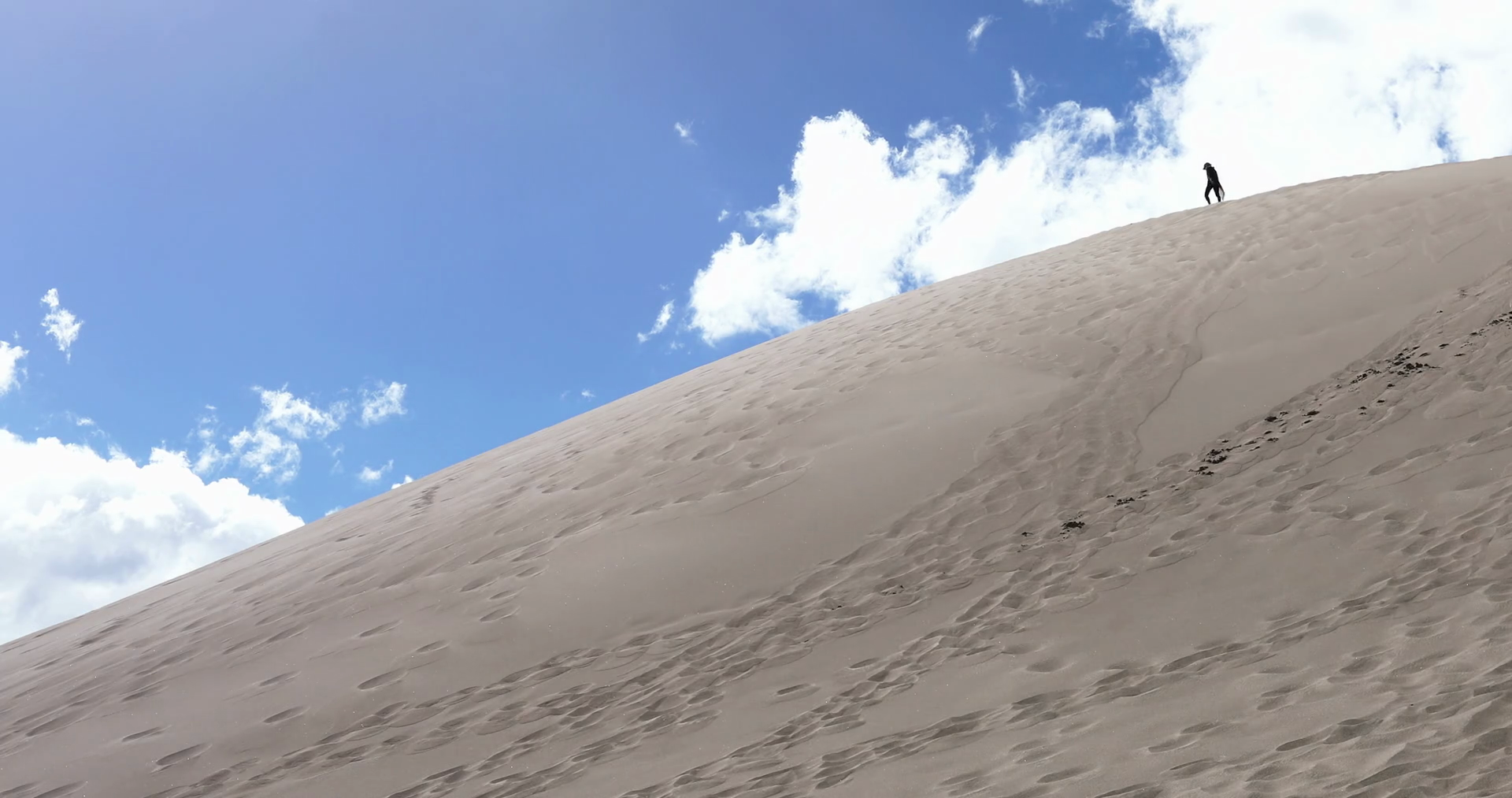 Person Walking Across Sand Dunes In Great Stock Footage SBV-311195479 ...