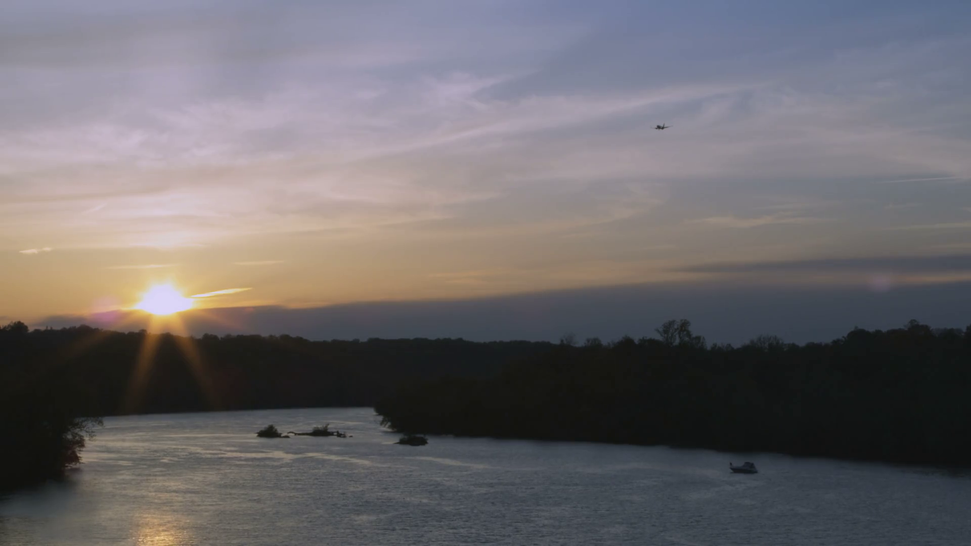 Plane In Distance Flying Past Sunset Stock Footage SBV-300164982 ...