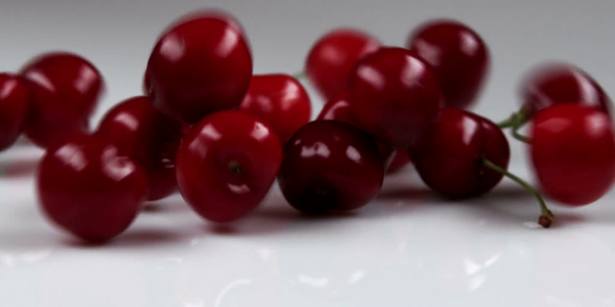Red Cherries Falling Onto Table Stock Footage SBV-300067024 - Storyblocks