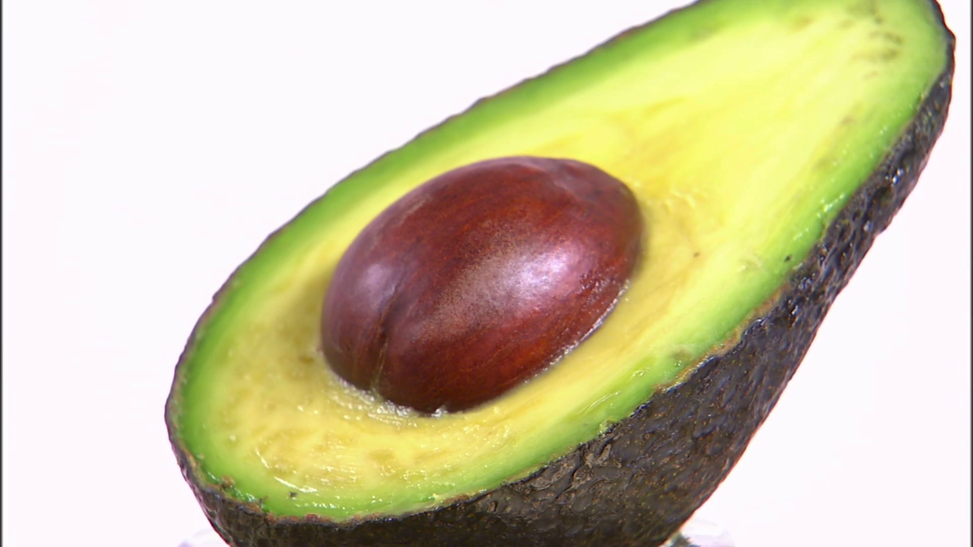 Sliced Avocado Rotating On White Background 2 Stock Footage SBV ...